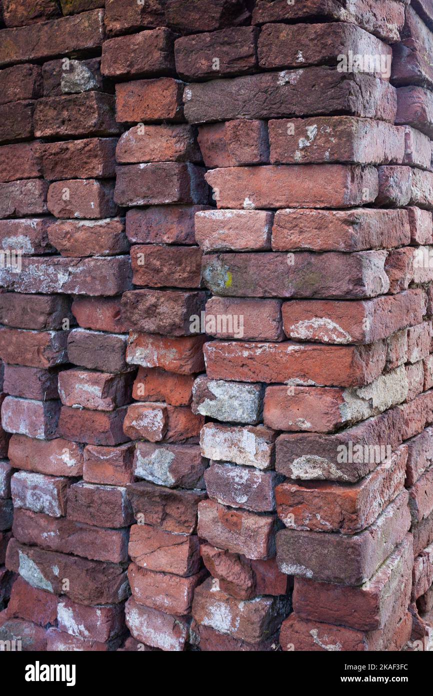 A vertical of a pile of old bricks in various colors Stock Photo - Alamy