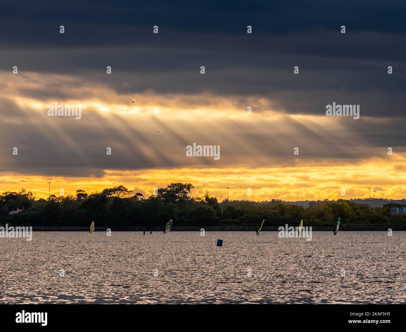 Sun rays beaming down on Malahide Estuary Stock Photo - Alamy
