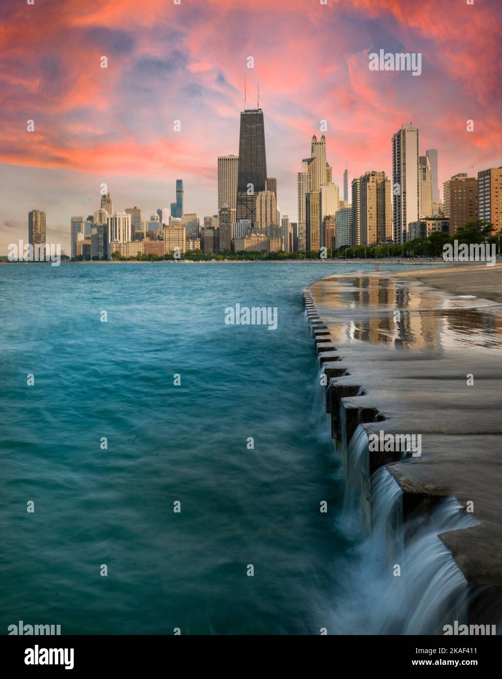 A vertical shot of Chicago Downtown with high skyscrapers at sunset in ...