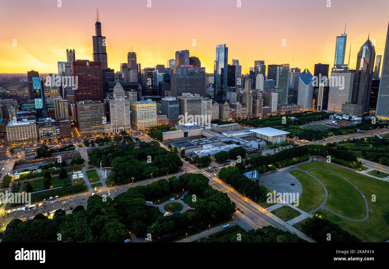An aerial view of Chicago Downtown with high skyscrapers at sunset in ...