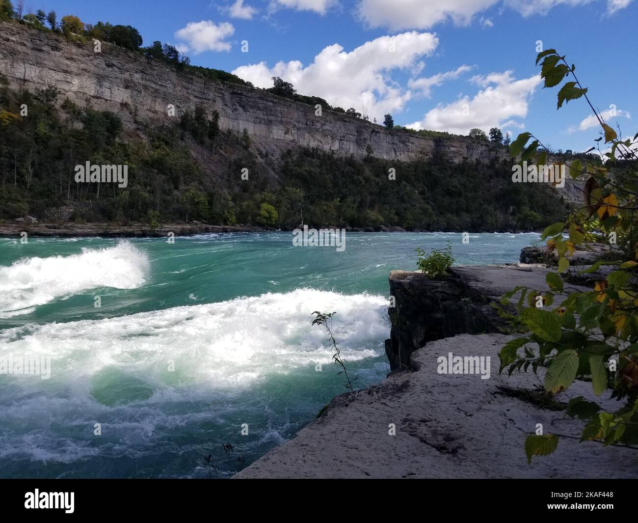 The raging river with big rocks in Niagara Falls, Canada Stock Photo ...
