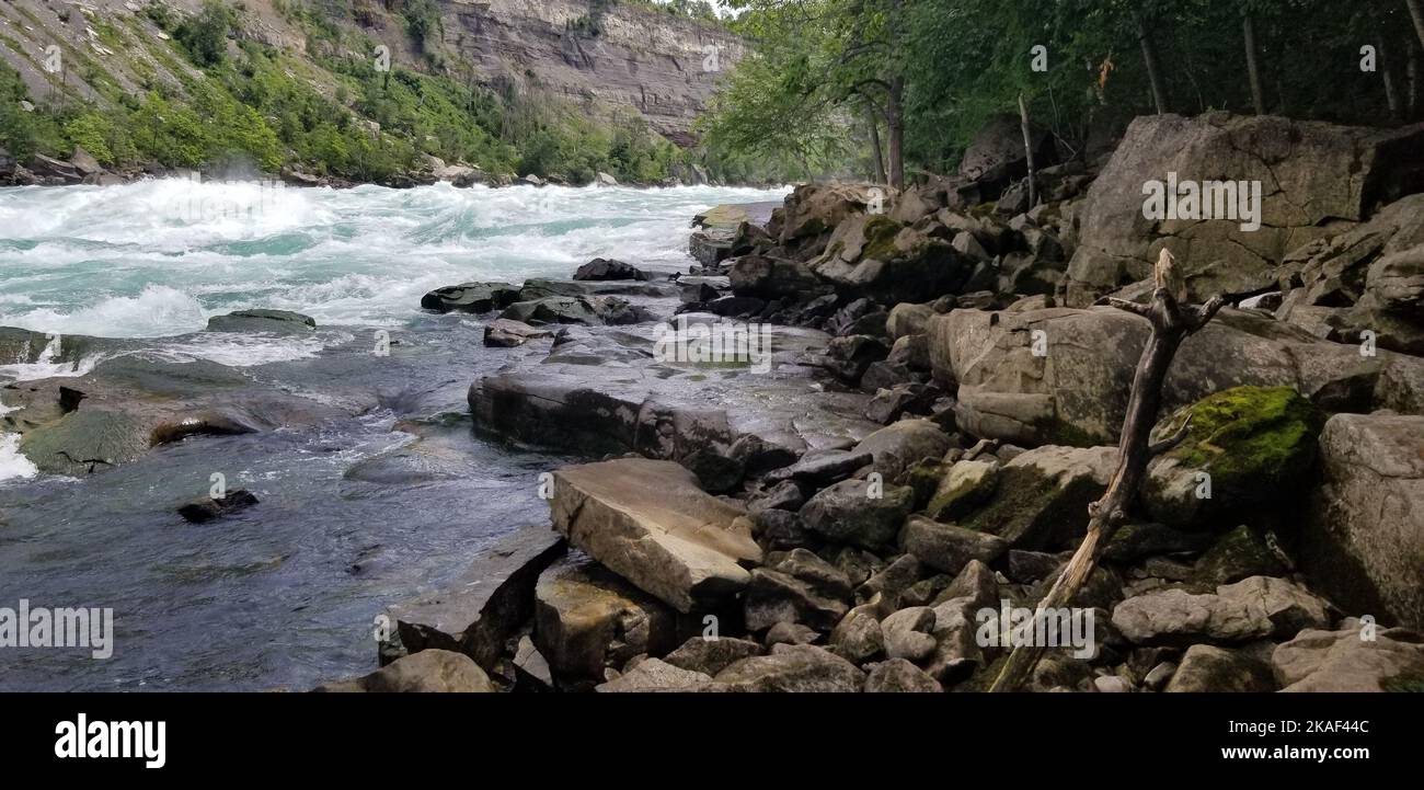 The raging river with big rocks in Niagara Falls, Canada Stock Photo ...