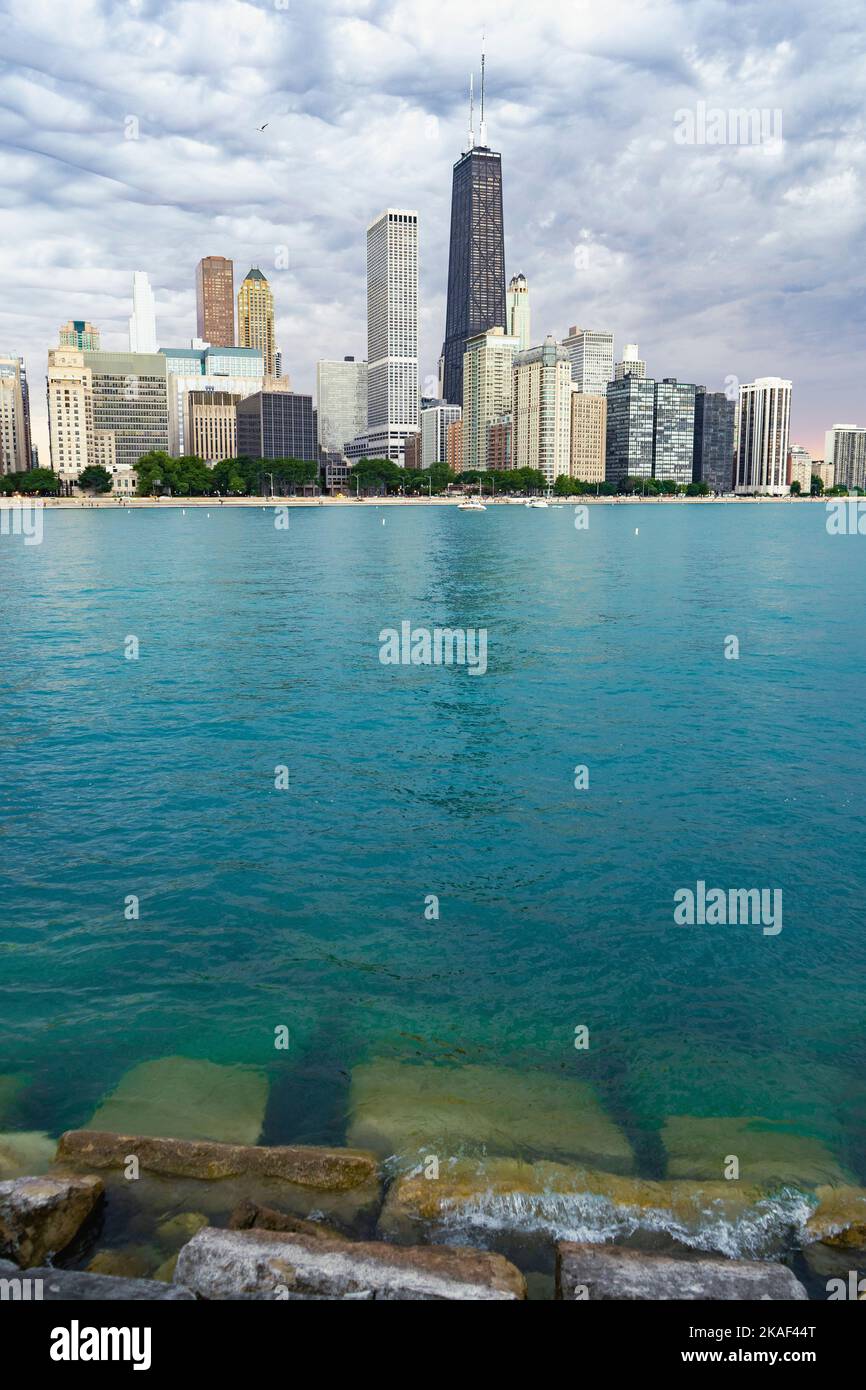 A vertical shot of Chicago Downtown with high skyscrapers and lake ...