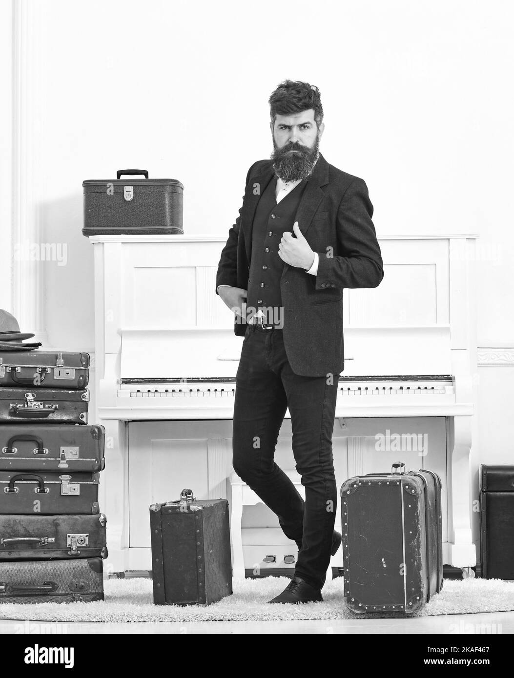 Man, traveller with beard and mustache with luggage, luxury white ...