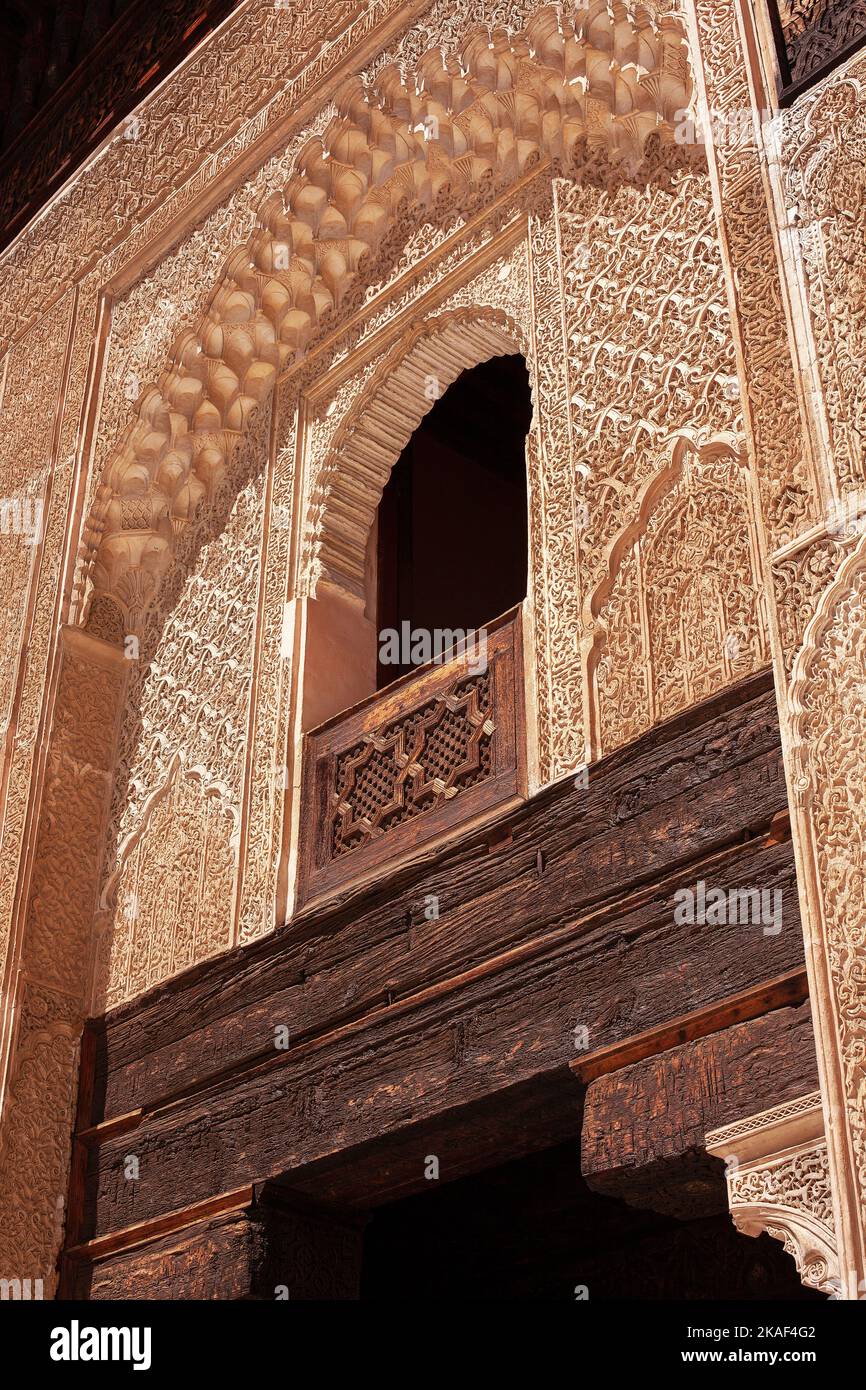 A vertical closeup of the beautiful details of an arch on the mosque ...
