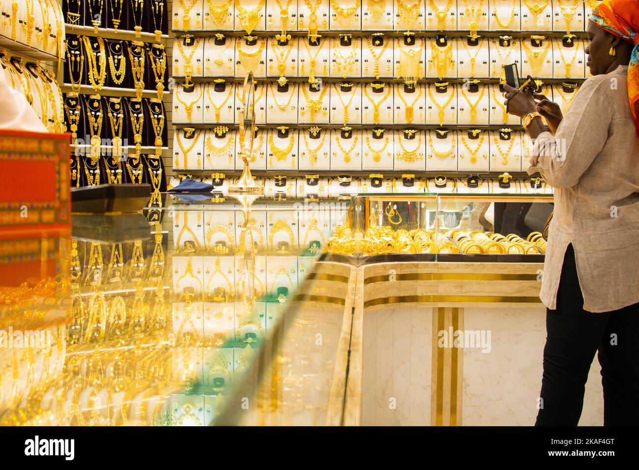 Dubai, UAE - 12th october, 2022 : african woman wear golden luxury ...