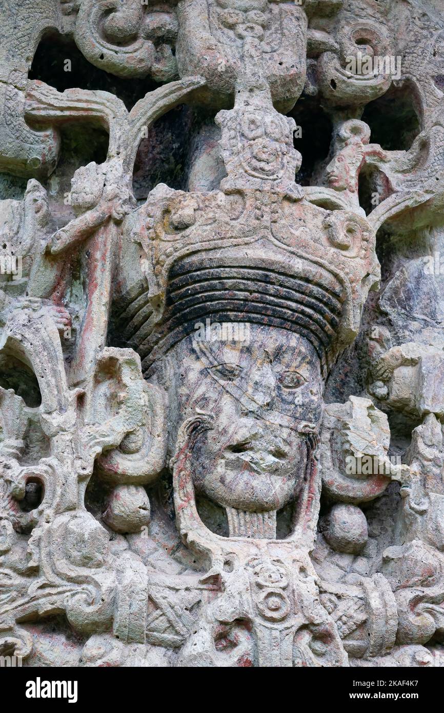 A vertical shot of a human face on a concrete wall design of the Copan ...