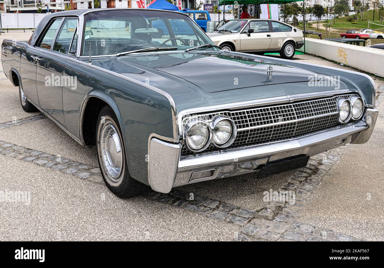 A historic gray vintage Lincoln Continental car parked in a parking lot ...