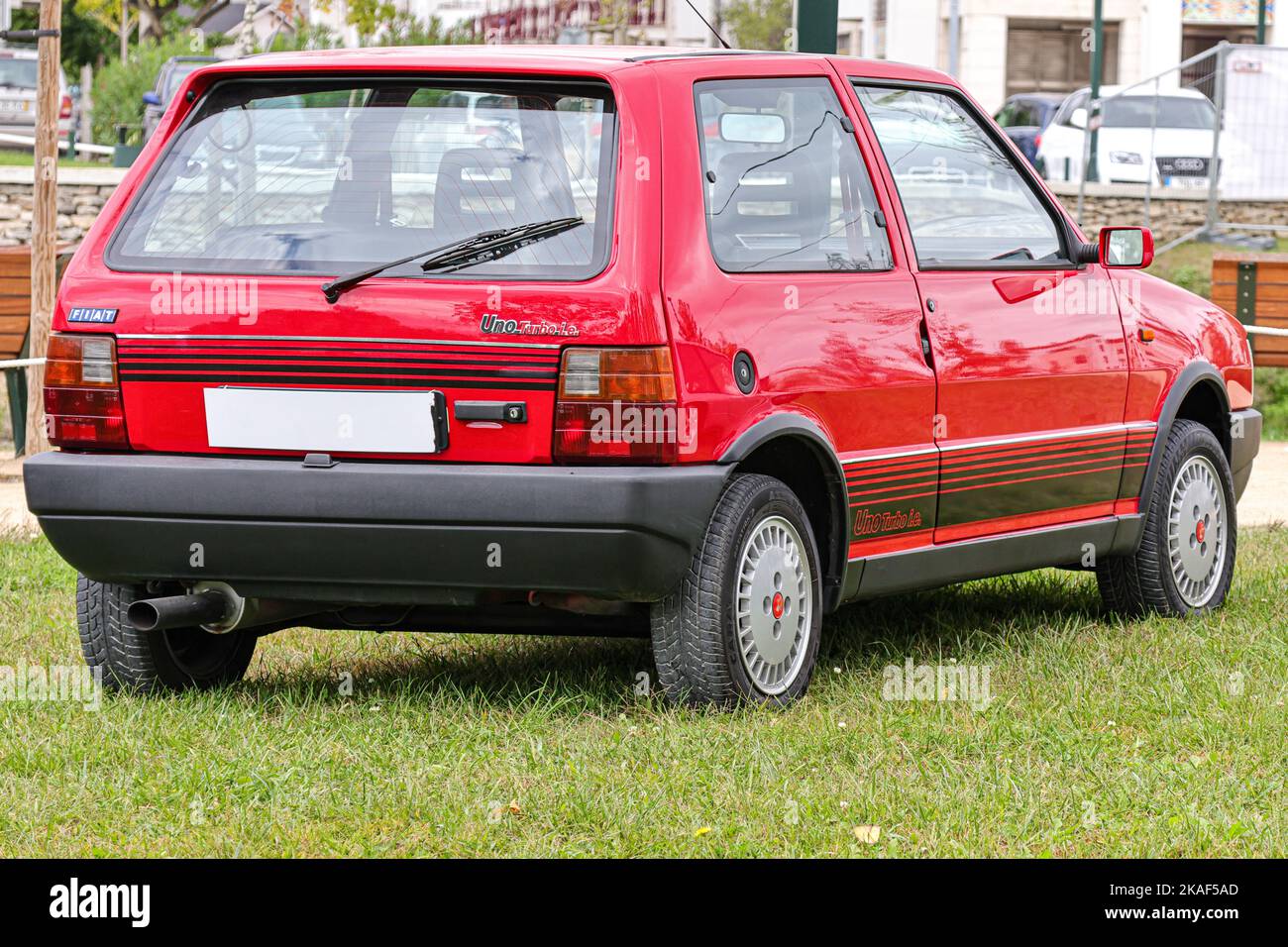A red sports car Fiat Uno Turbo i.e standing on the green grass Stock ...