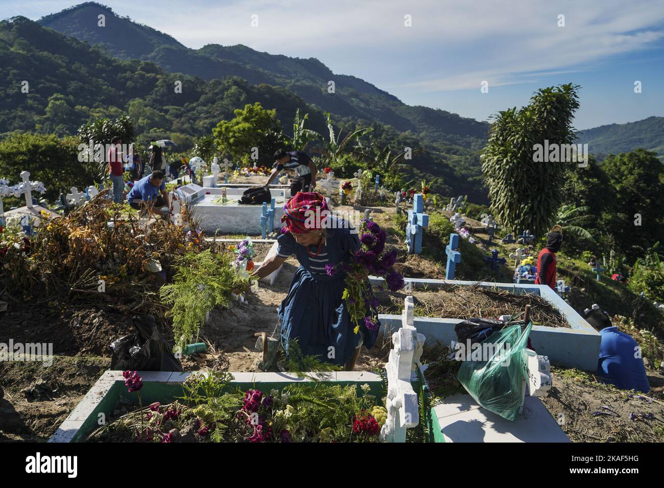 An indigenous woman traditionally called "Panchita" places flowers on a ...