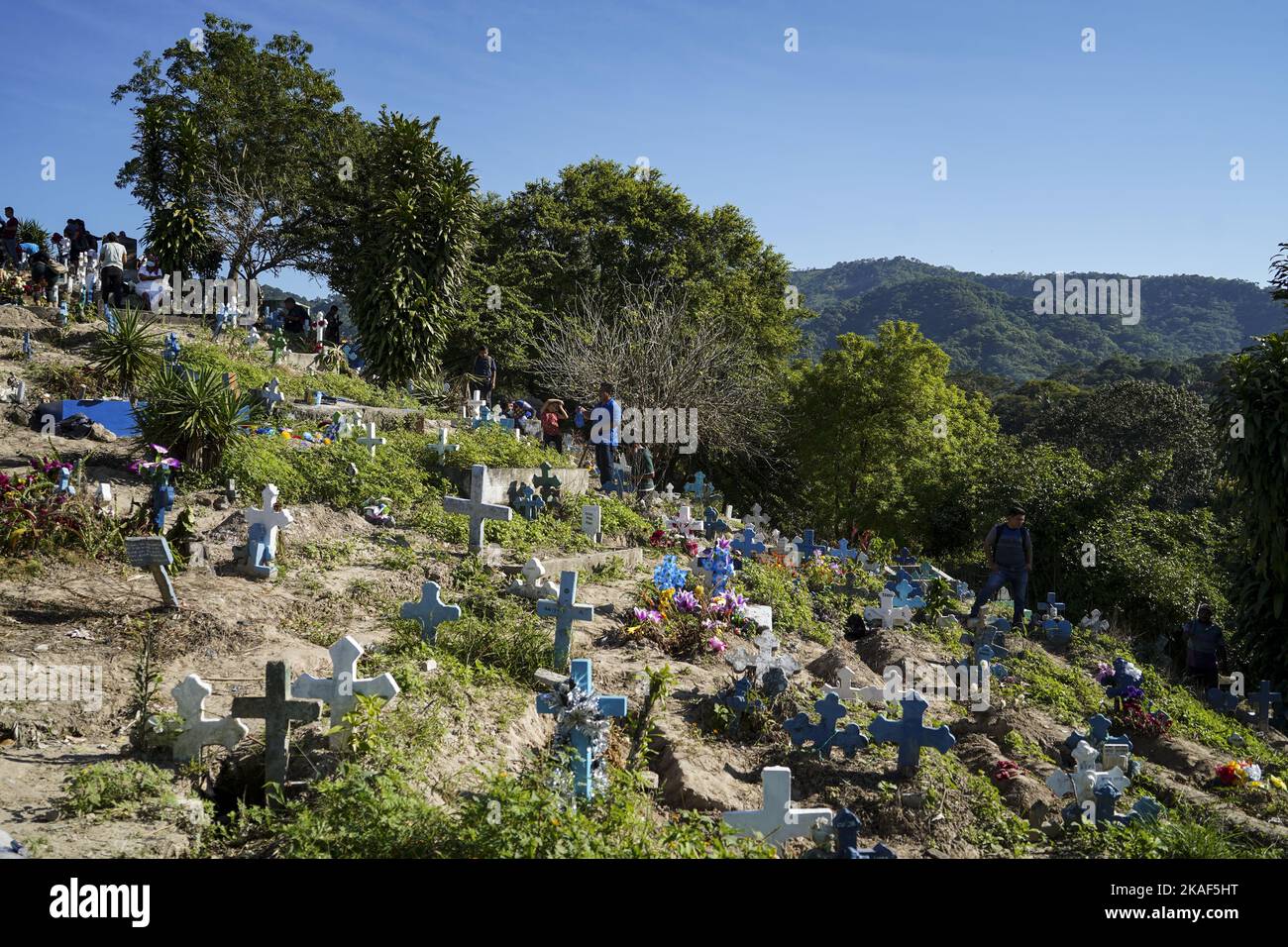 General view of a cemetery as families visit their loved ones' graves ...