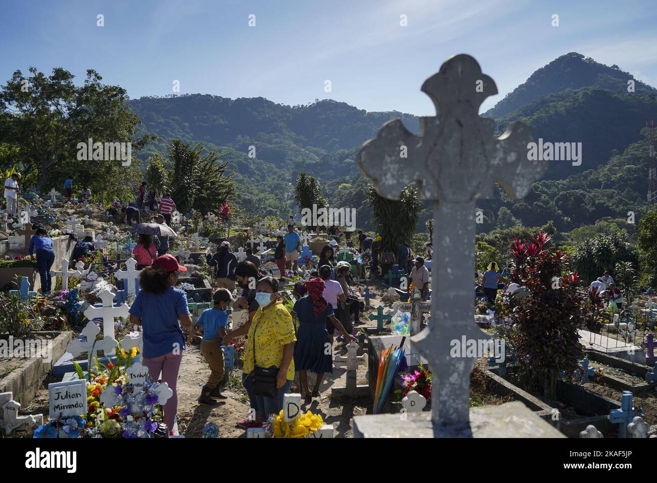 General view of a cemetery as families visit their loved ones' graves ...