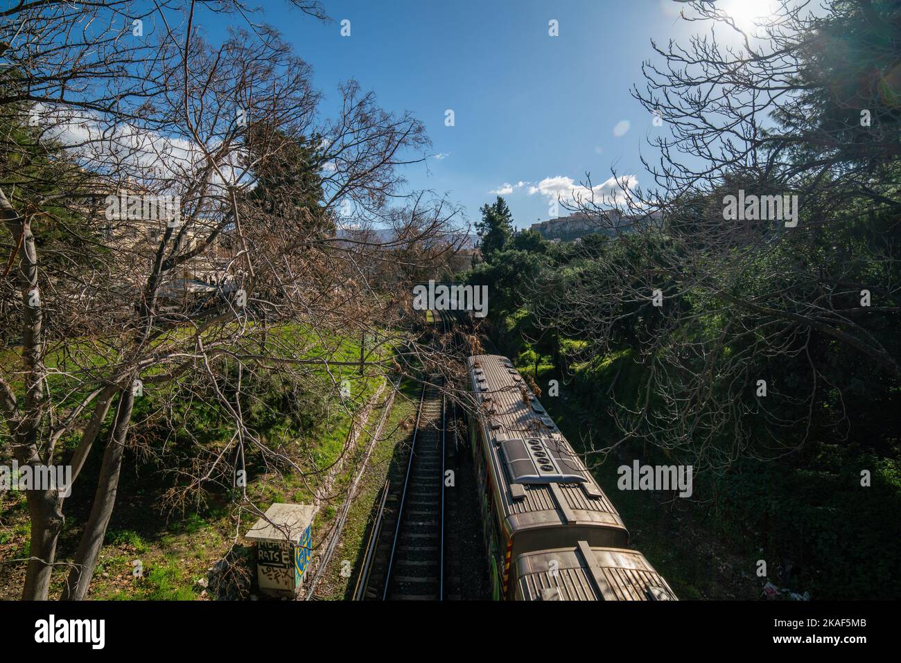 Athens of Greece, train under the Acropolis Stock Photo - Alamy