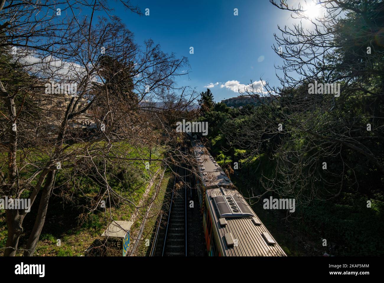 Athens of Greece, train under the Acropolis Stock Photo - Alamy