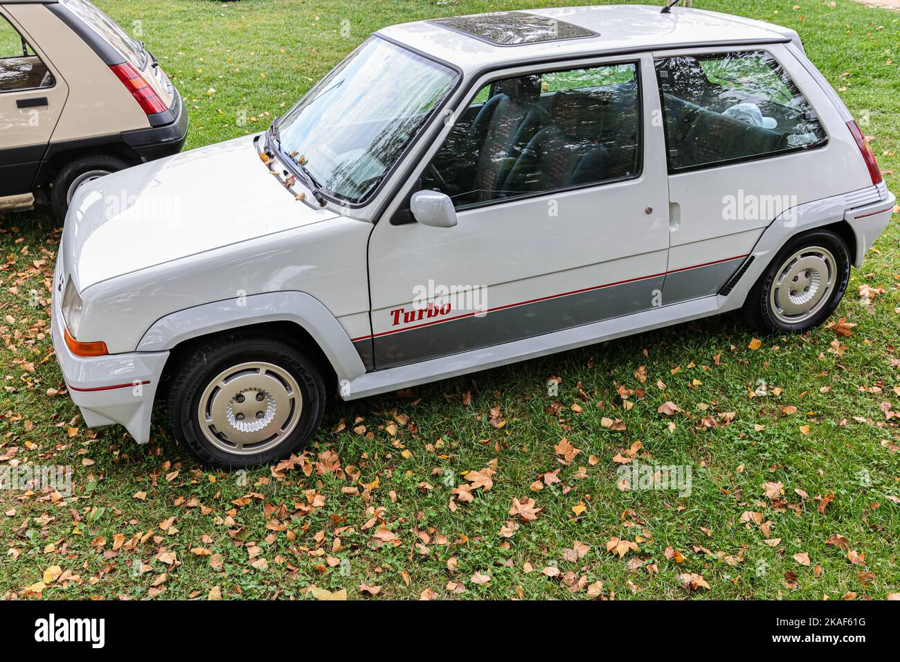 A historic white Renault 5 Turbo car during an exhibition in a park ...