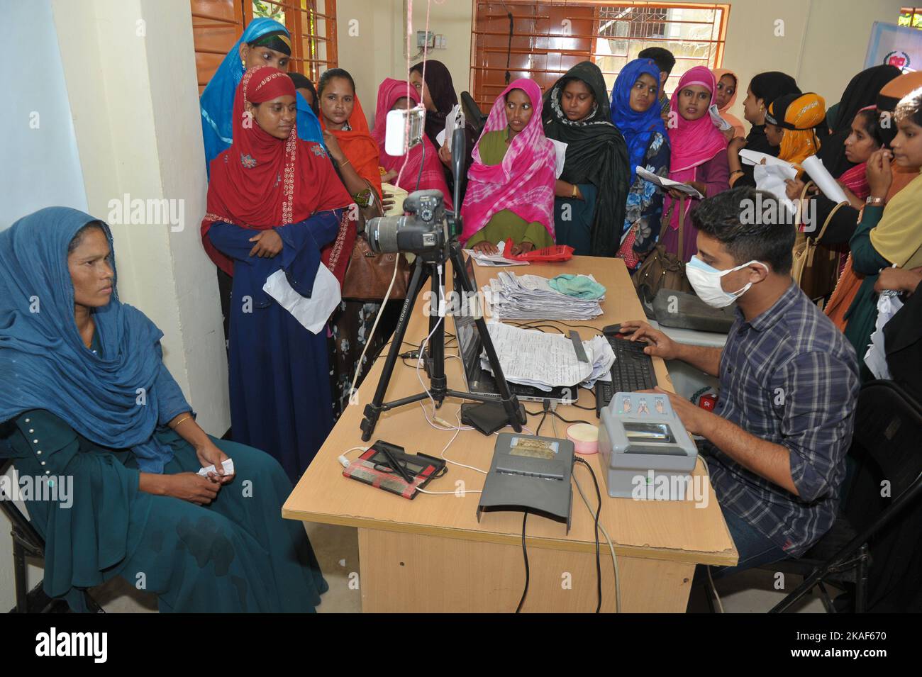 Non Exclusive: An Election Commission staff scanning the iris of a ...