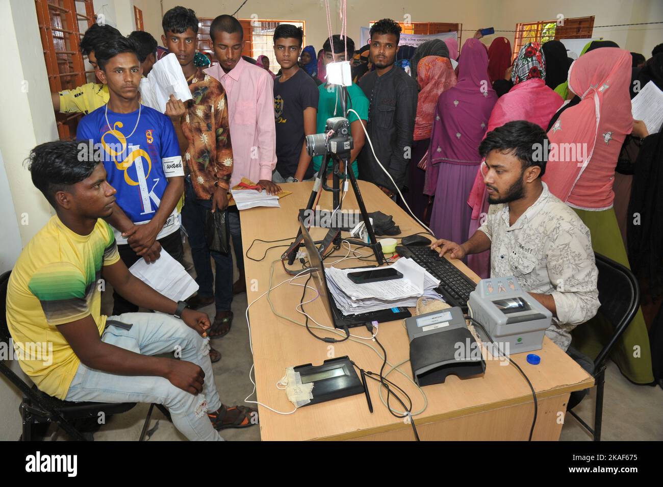 Non Exclusive: An Election Commission staff scanning the iris of a ...