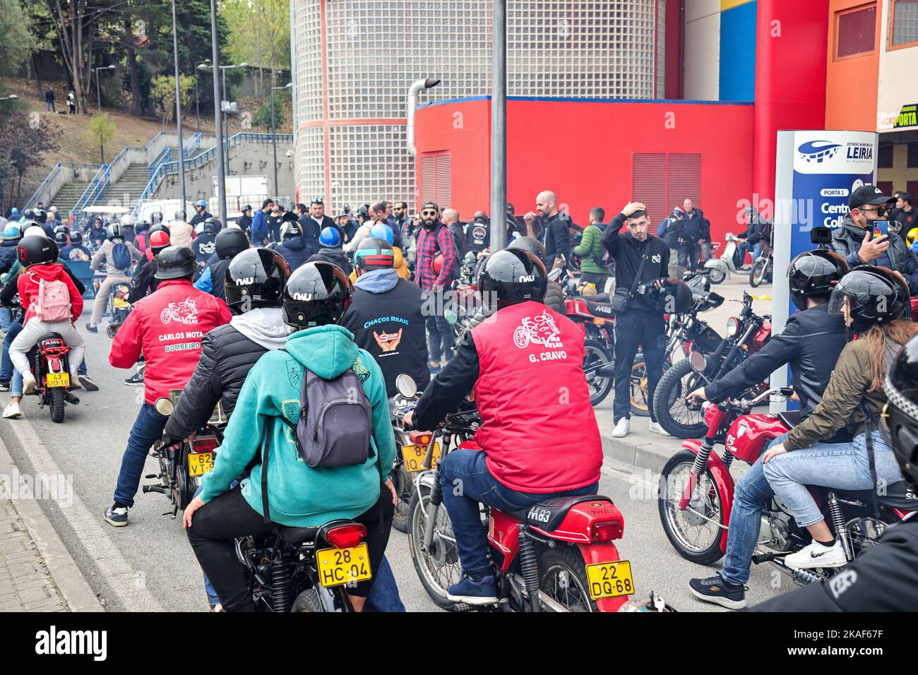 A group of people riding around on Vespa, zundapp, Famel XF, Piaggio ...