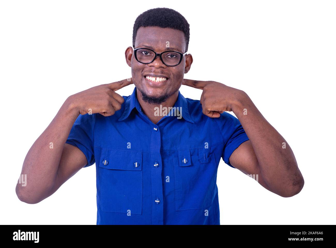 portrait of handsome young happy businessman pointing fingers on his ...