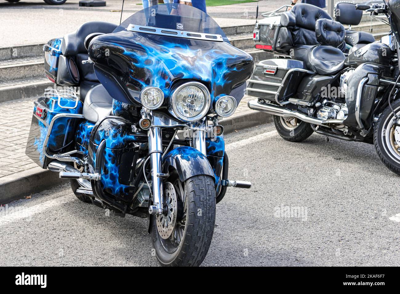 A beautiful blue Harley Davidson motorcycle parked on display on a road ...