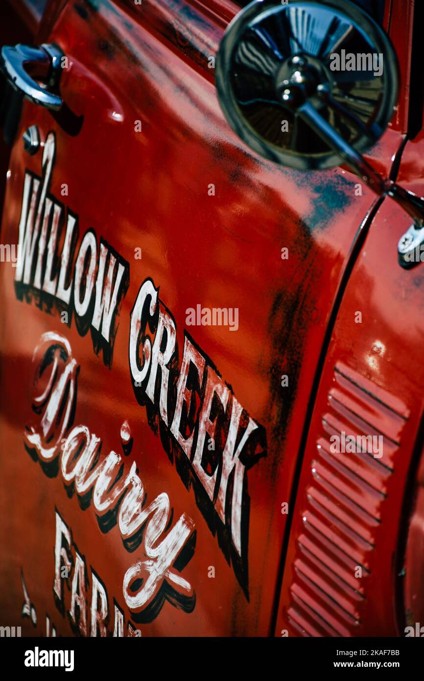 A closeup of a red vintage car with the "Willow Greek" pin at the ...