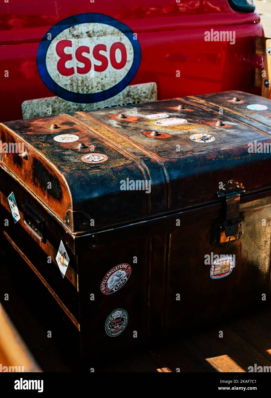A vintage dower chest in the trunk of a red pickup car at the Classic ...