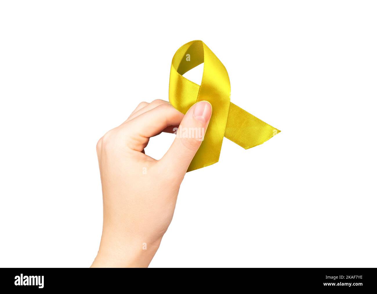 Hand holding yellow fabric ribbon with loop isolated on white ...