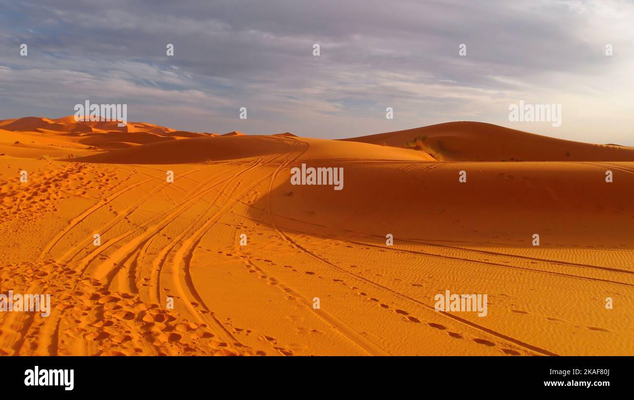 A sand landscape with blue cloudy sky in a desert of Morocco Stock ...
