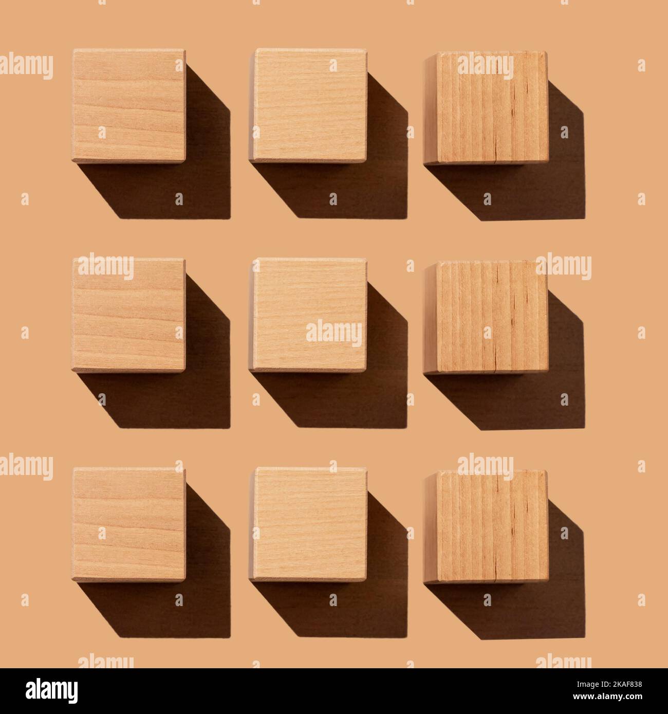 Wood cubes structure of square shape on wooden table. High quality ...