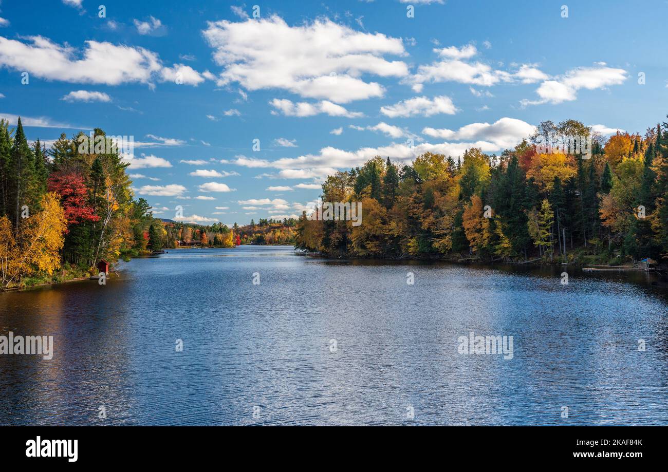 Autumn leaves and trees surround Chateaugay Lake in Ellenburg in New ...