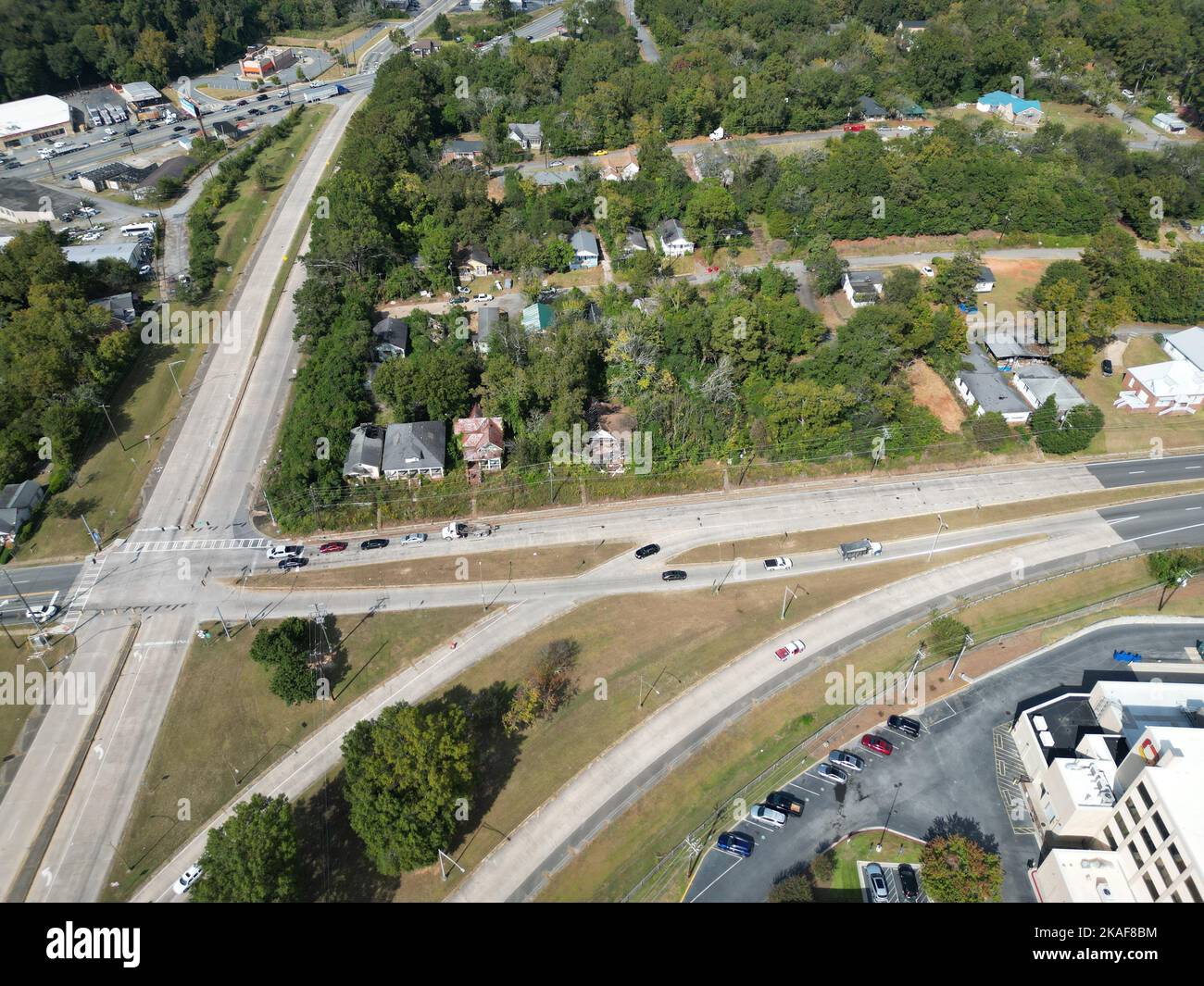 A bird's eye view of highways surrounded by trees and residence Stock ...