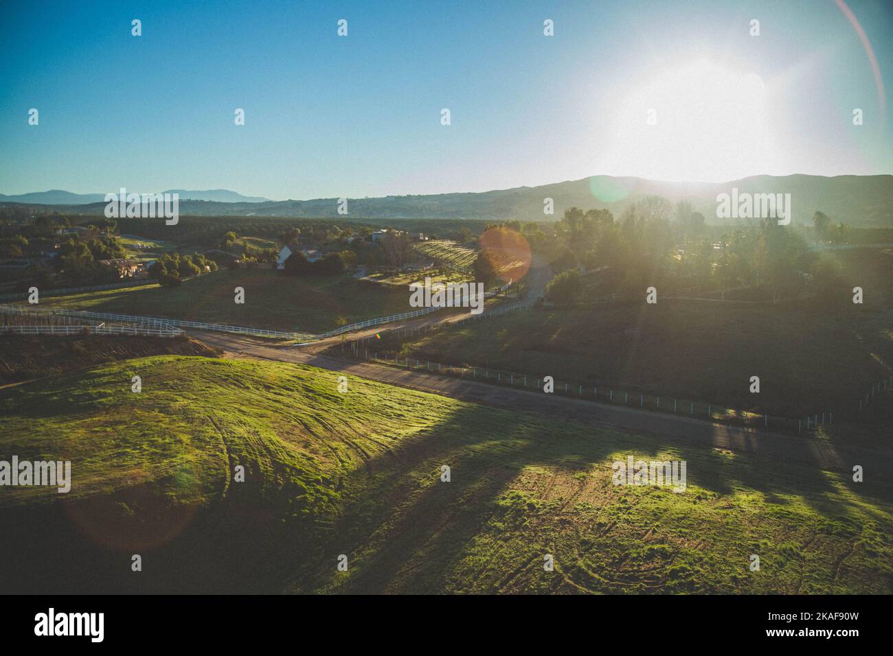 The bright sun shining over scenic vineyards in Temecula, Southern ...