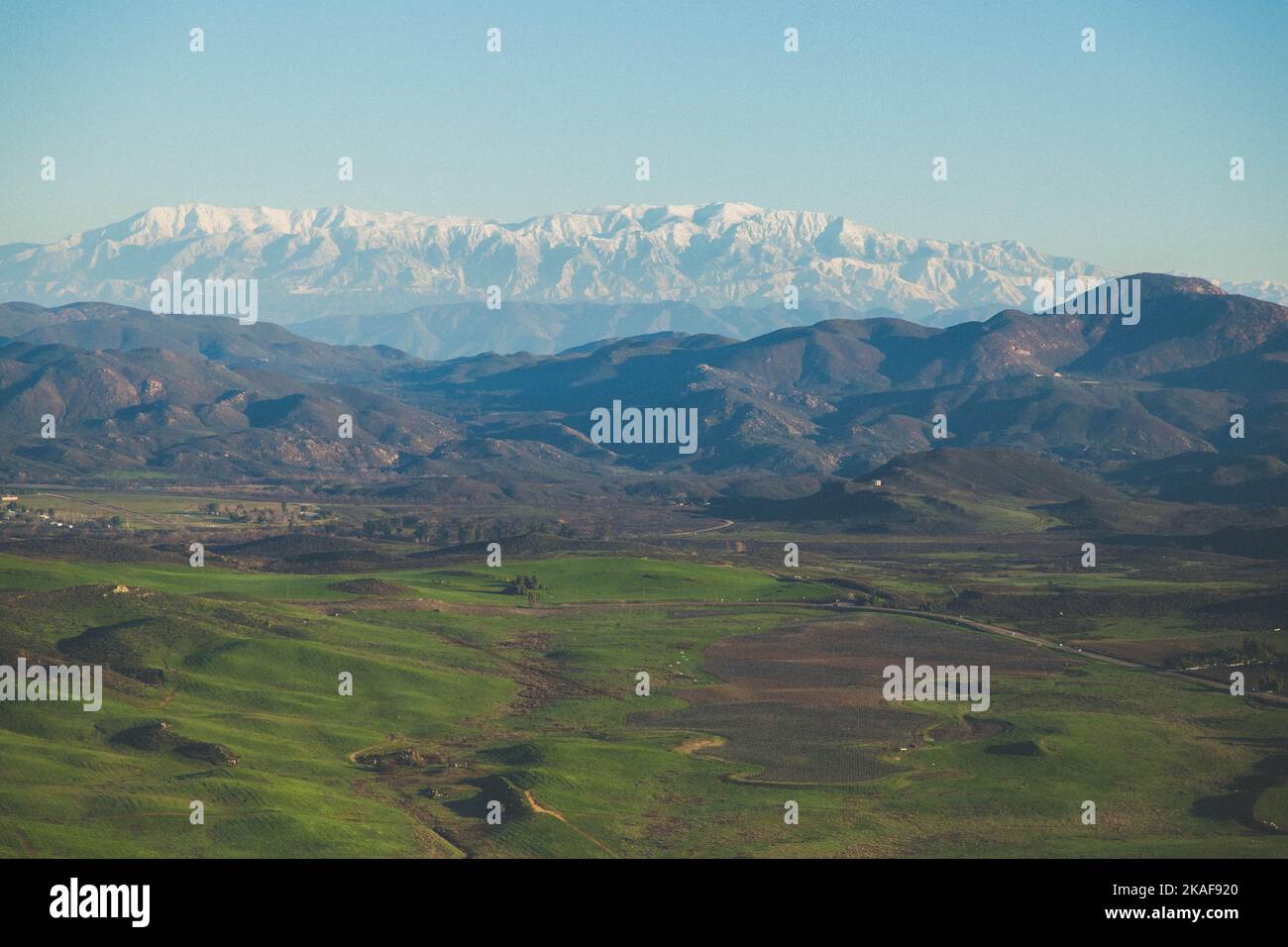 Peaceful landscape with a range of scenic hills in the background ...