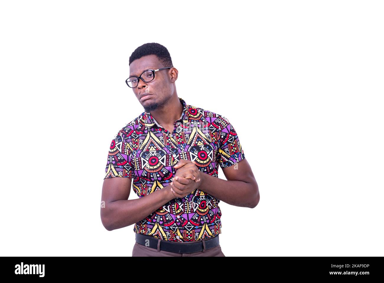 a young man in glasses standing on white background making apology ...
