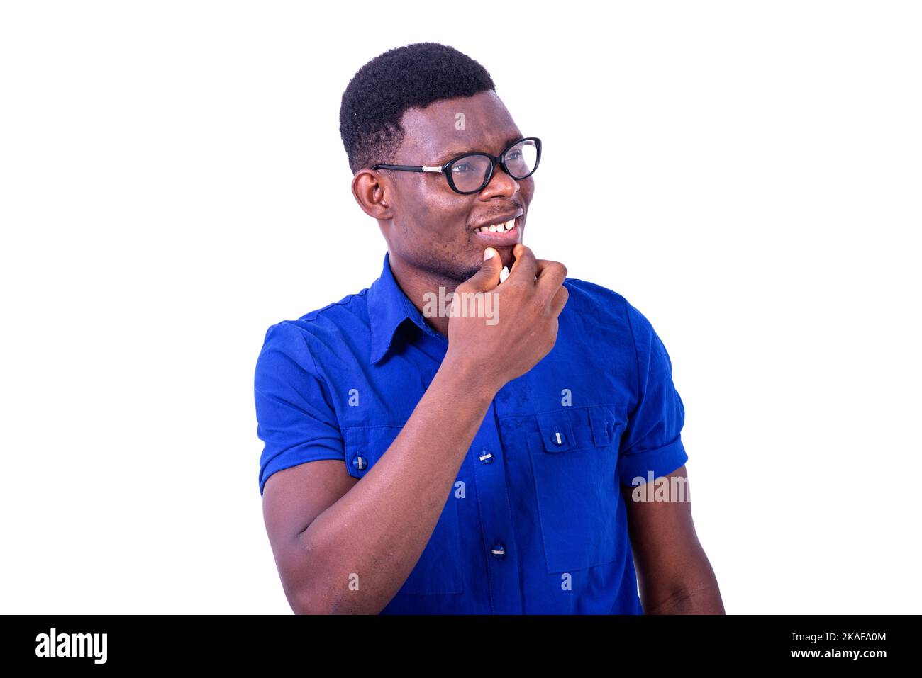 pensive young man wearing optical glasses, and looking sideways with ...
