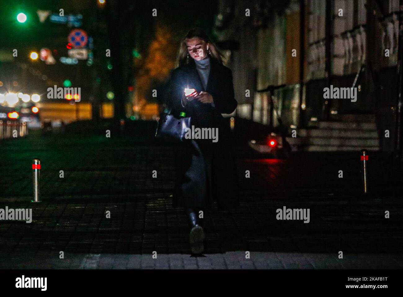 Kyiv, Kyiv, Ukraine. 2nd Nov, 2022. A female person using a torch on ...