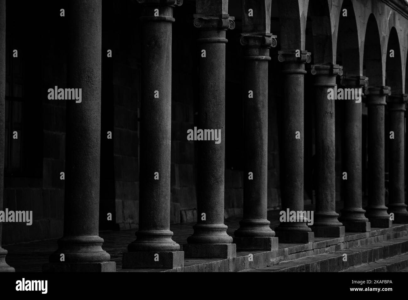 A greyscale shot of colonial arches in Cusco, Peru Stock Photo - Alamy
