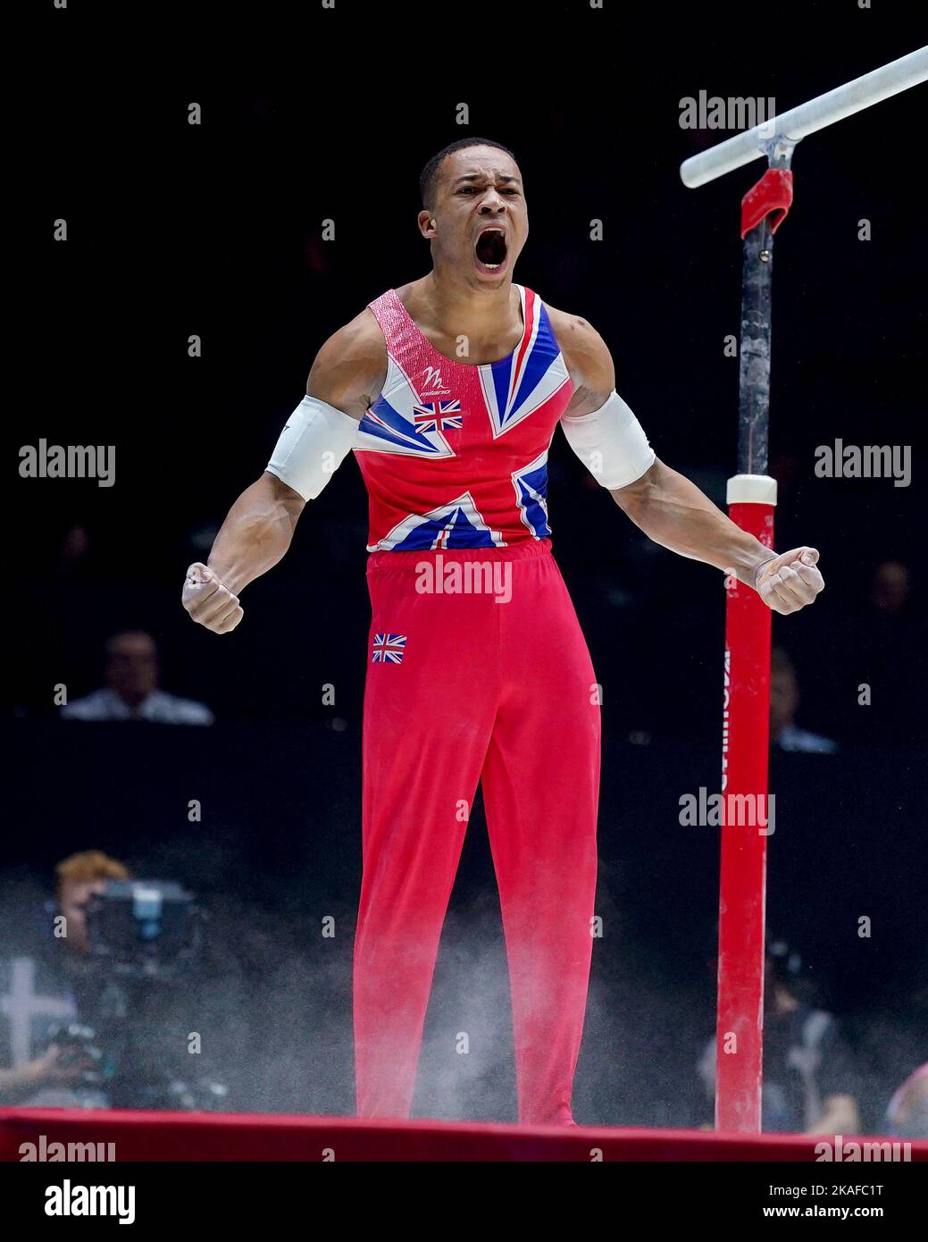 Great Britain's Joe Fraser reacts after performing on the parallel bars ...