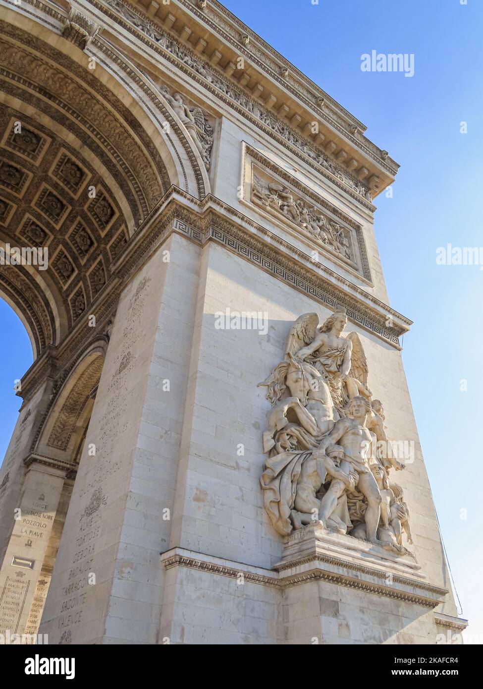 A vertical shot of the triumphal arch in Paris and a detailed depiction ...