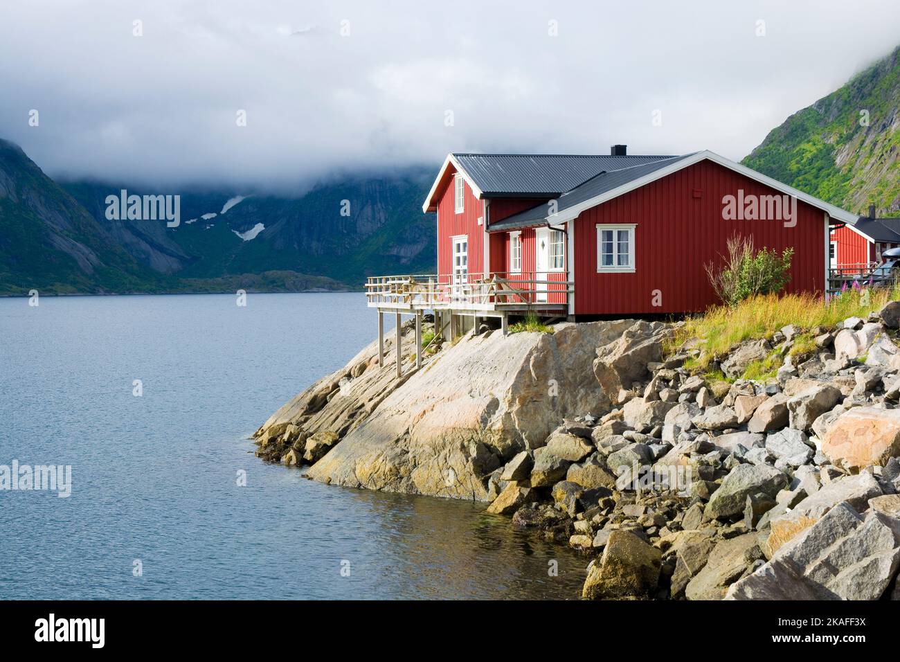 Traditional red wooden house on the coast of Reinefjorden, Lofoten ...