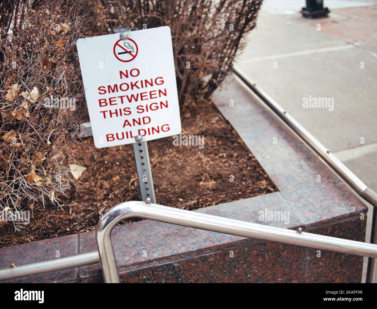 The view of "No smoking" sign on business building stair walkway and ...