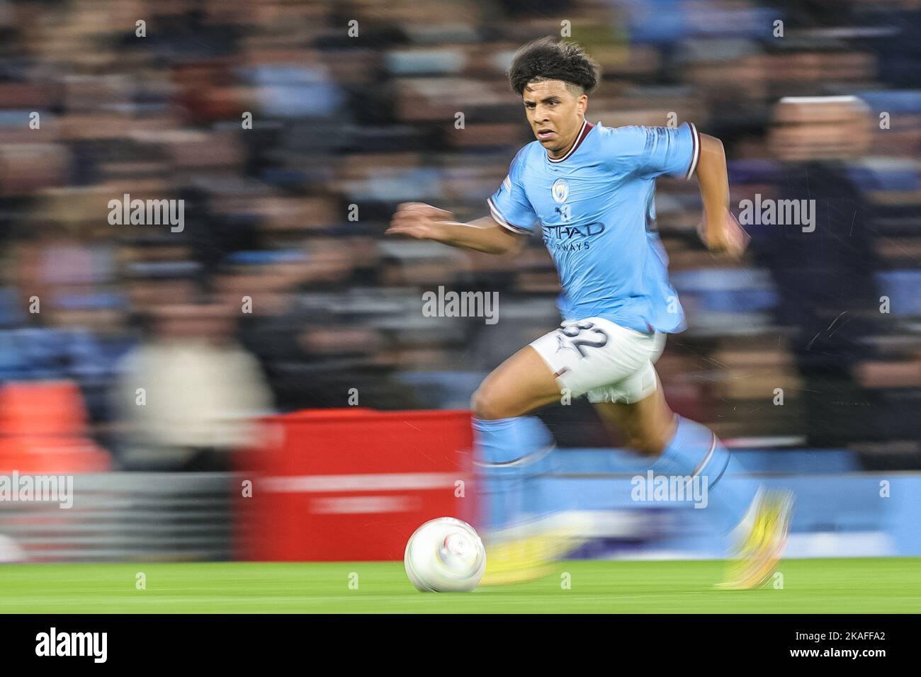 Rico Lewis #82 of Manchester City runs with the ball during the UEFA ...