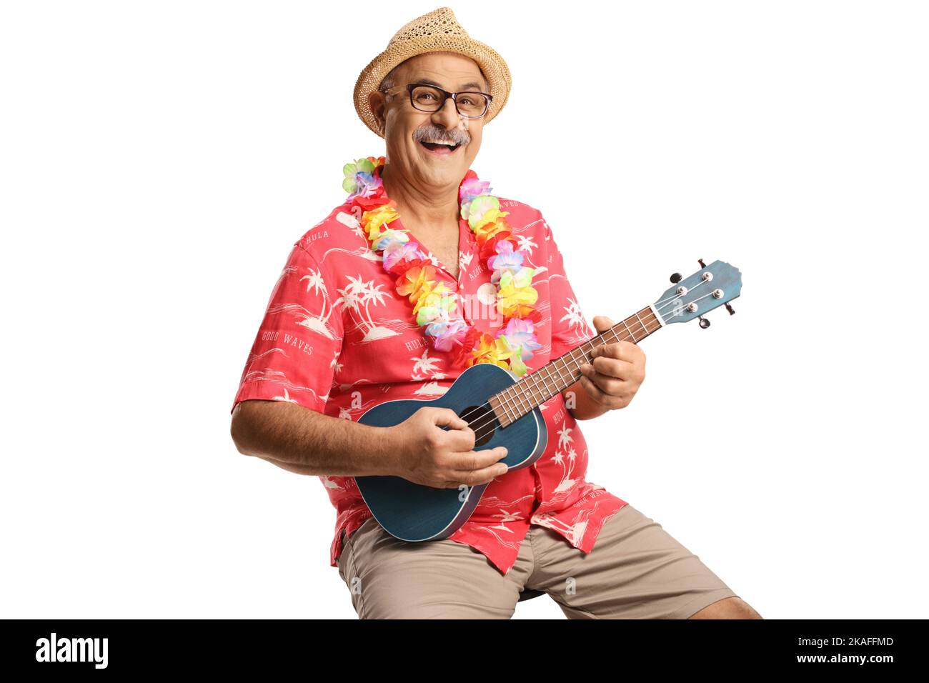 Marture man with flower chain around neck playing ukulele and smiling ...