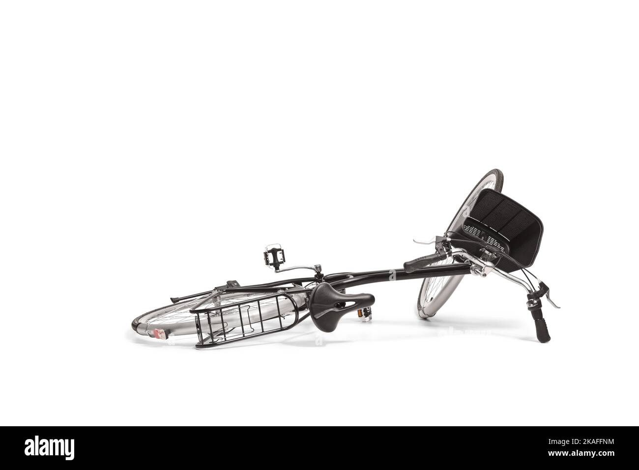 Studio shot of a bicycle falling on the ground isolated on white ...