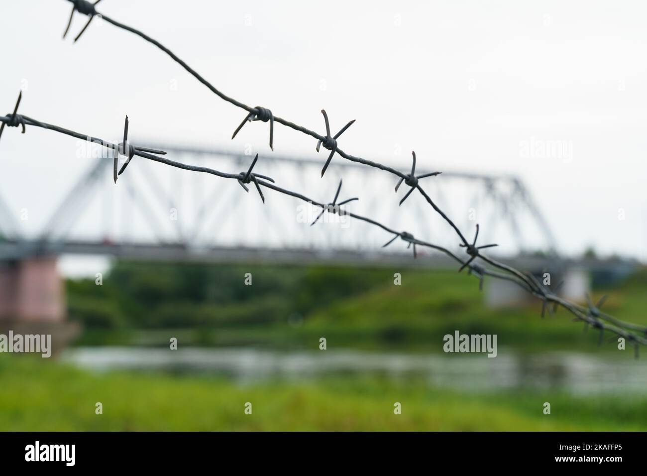 The concept of transport security. Barbed wire on the background of the ...