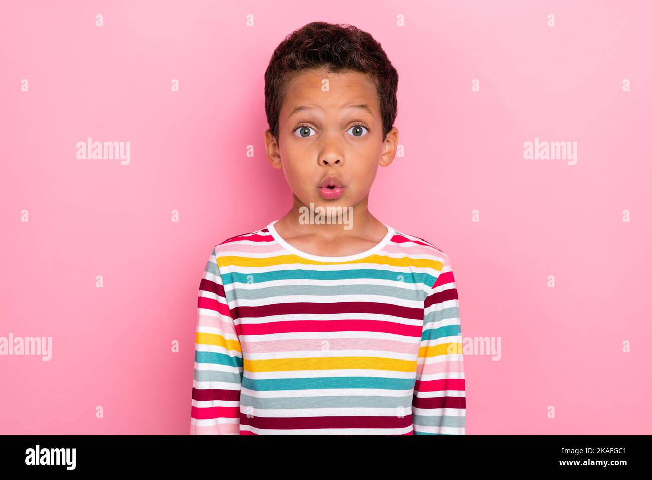 Photo portrait of astonished pupil latin small boy shocked face staring ...