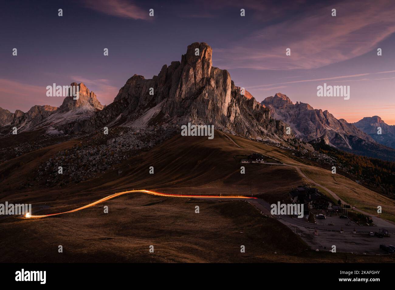 Sunrise on the Giau Pass in the Dolomites with the luminous rock faces ...