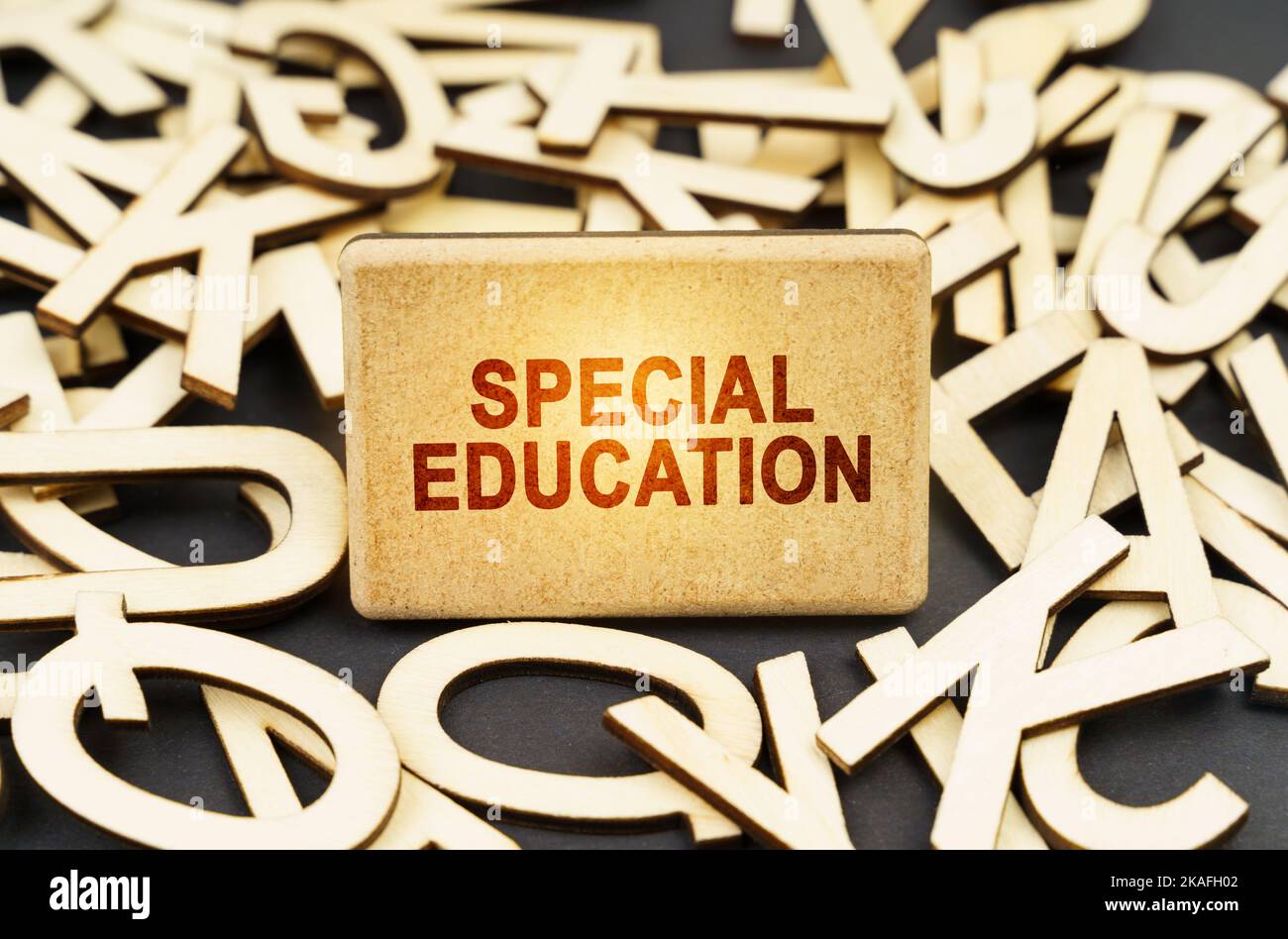 Education concept. Among the wooden letters is a sign with the ...