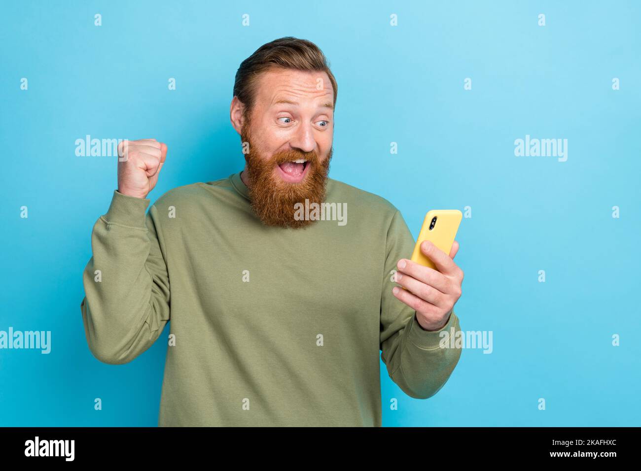 Photo of overjoyed positive man wear stylish sweater celebrate success ...