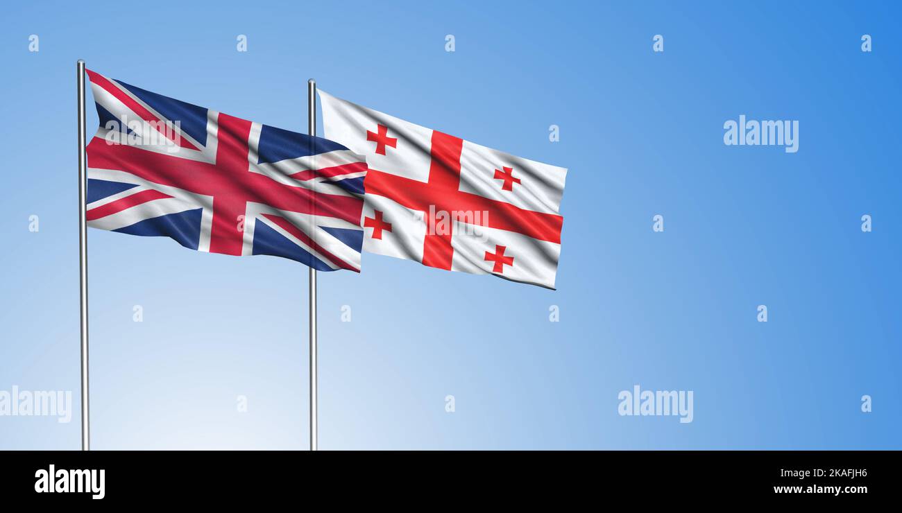 United Kingdom flag and Georgia flag, with blue sky Stock Photo - Alamy